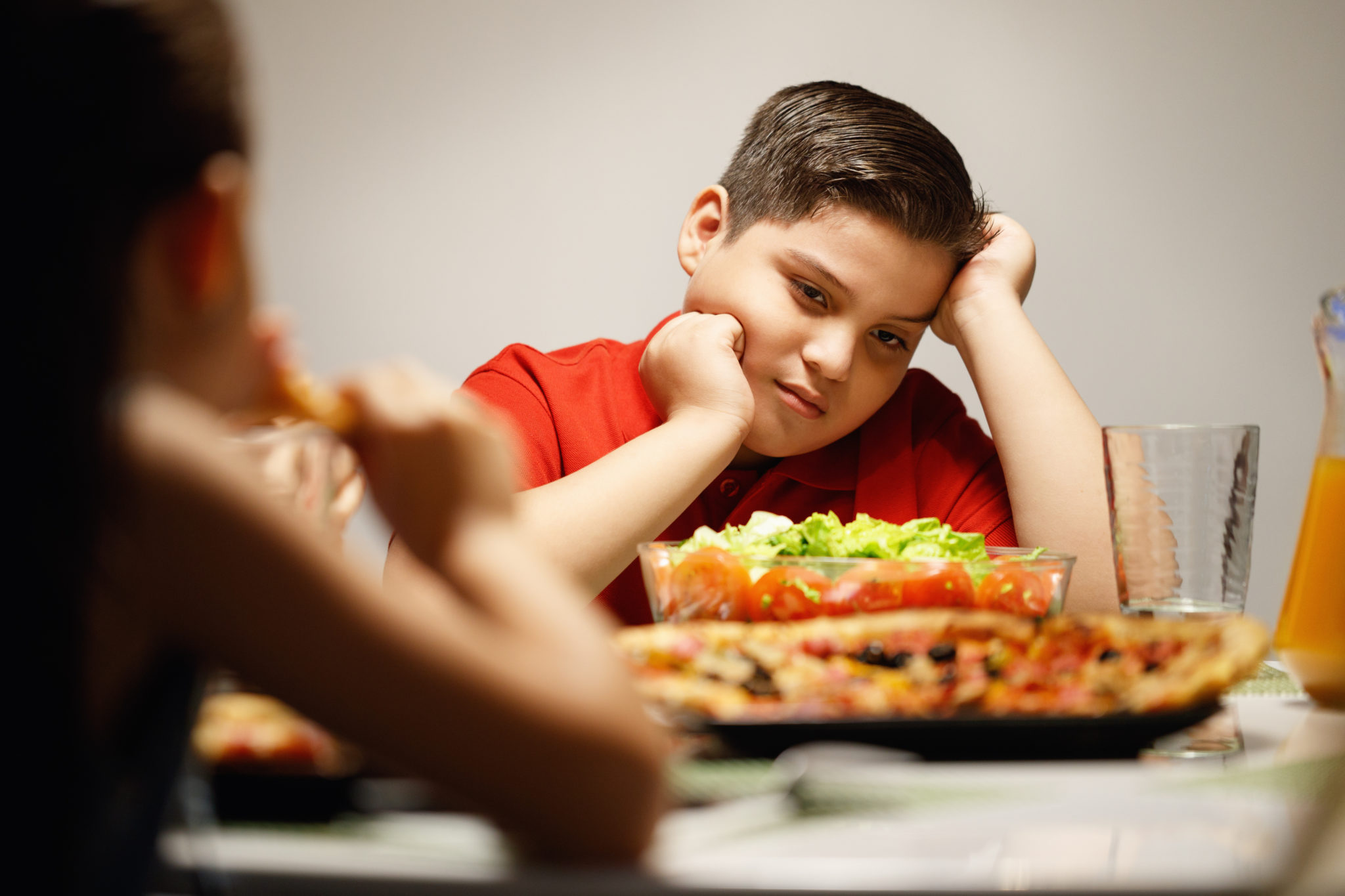 Mother Giving Salad Instead Of Pizza To Overweight Son SpiderFit Kids mother-giving-salad-instead-of-pizza-to-overweight-son-spiderfit-kids