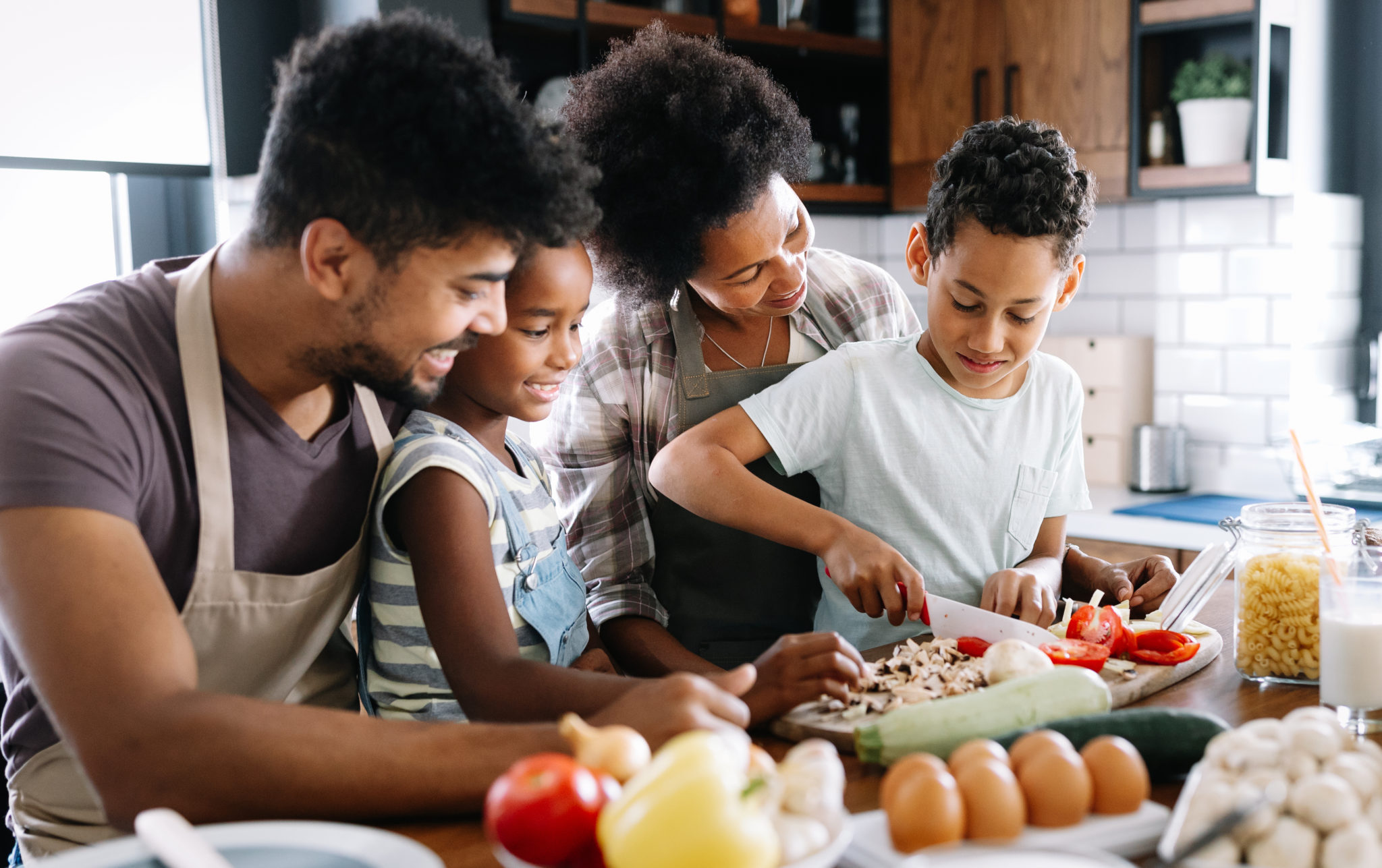 Happy Family In The Kitchen Having Fun And Cooking Together Healthy happy-family-in-the-kitchen-having-fun-and-cooking-together-healthy